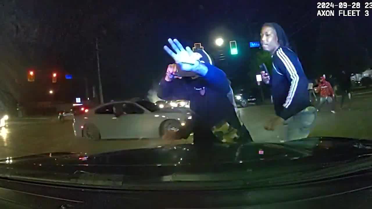 Watch: Street takeover crowd swarms police car with officer inside ...